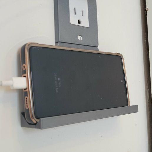 STL file Wall outlet plate with Vertical cell phone charging support ...