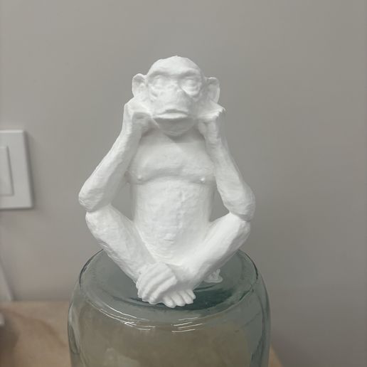 thinking chimp statue