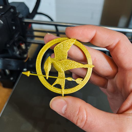 mockingjay hand symbol