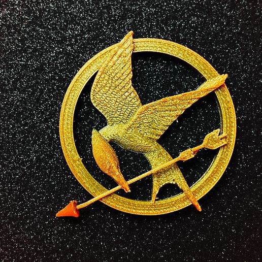 snow mockingjay pin